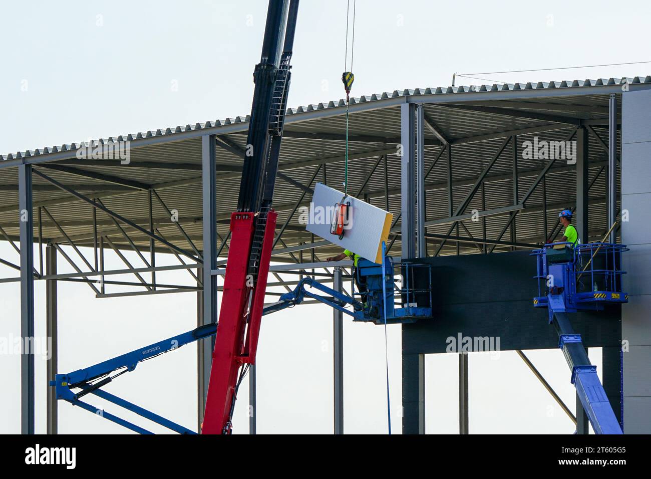 Sandwich panels wall assembly using telescopic boom crane and two self ...