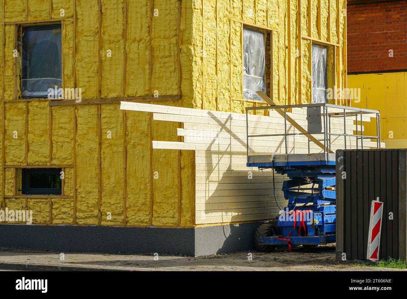 Residential house facade siding works with wooden planks after facade ...