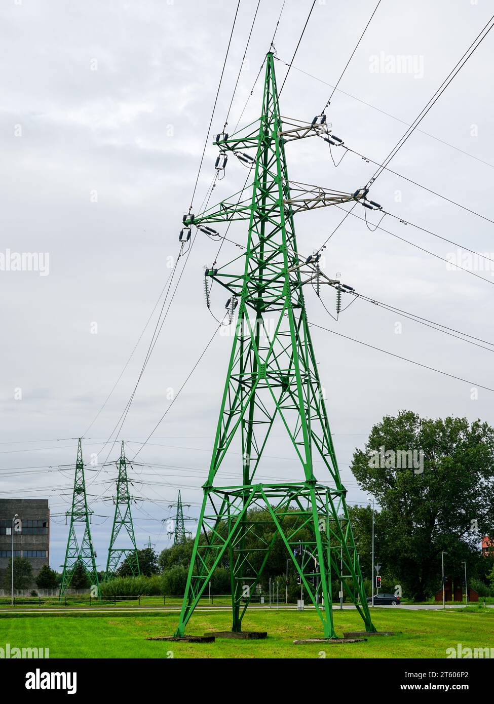 Industrial landscape with many high voltage power line poles and wires ...