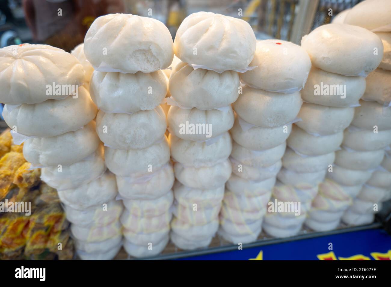 Chinese steamed buns in the steam pot displayed at the stall. Popular ...