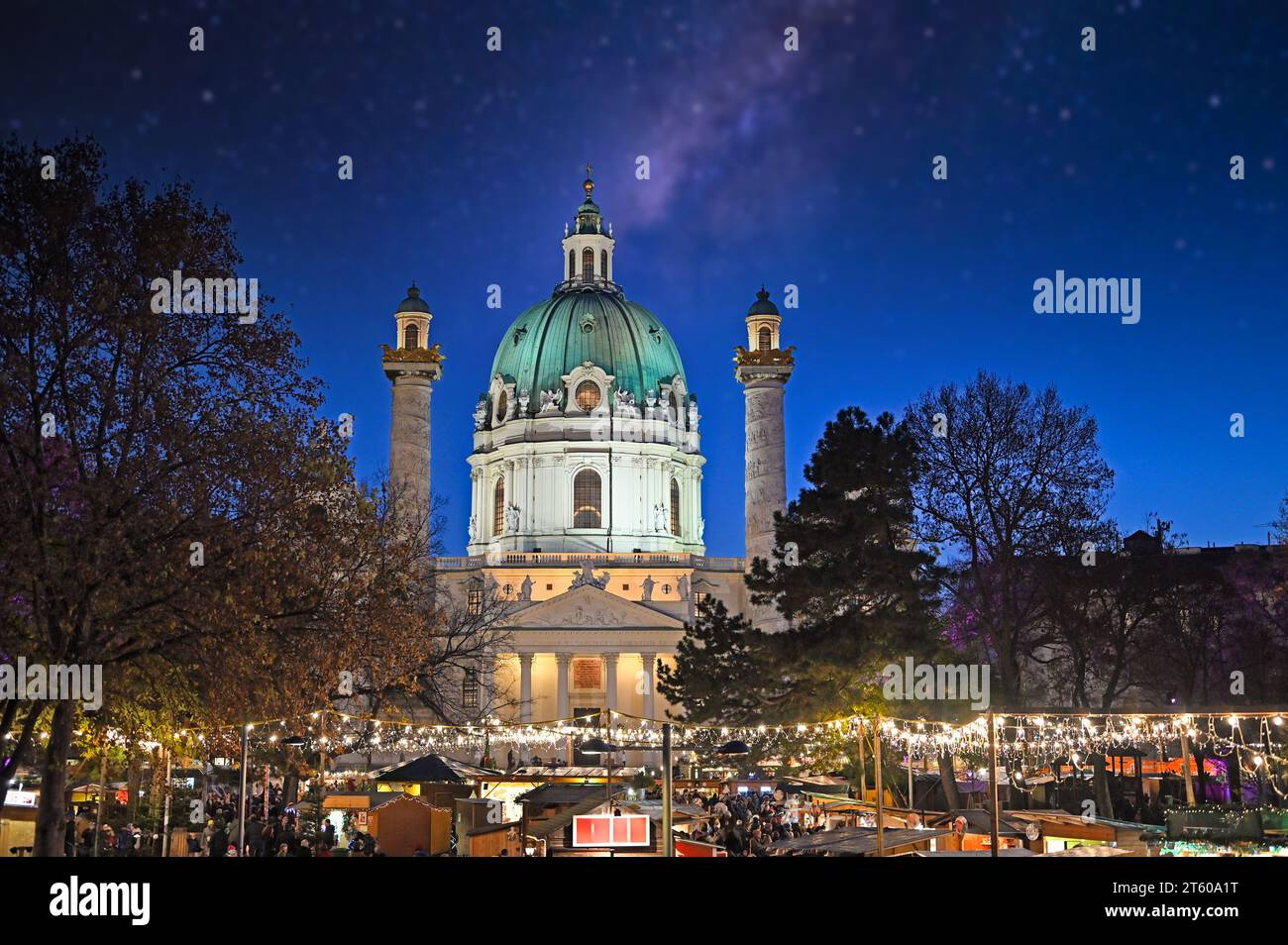 Christmas market on Karlsplatz in Vienna at night Stock Photo - Alamy