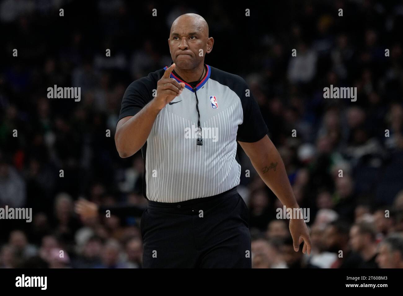 Referee Kevin Cutler signals during the first half of an NBA basketball ...