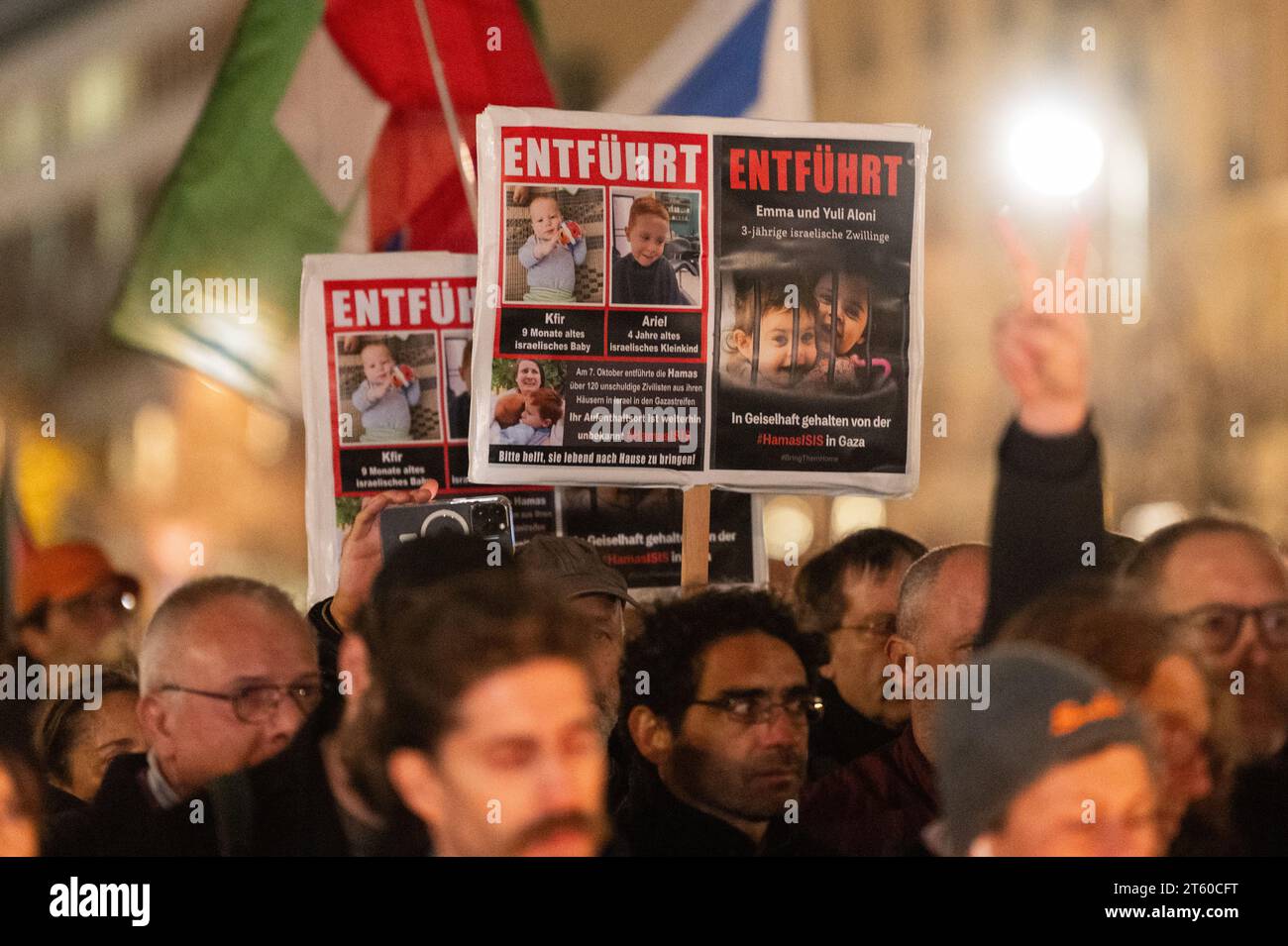 Berlin, Germany. 07th Nov, 2023. Participants stand with placards at a ...