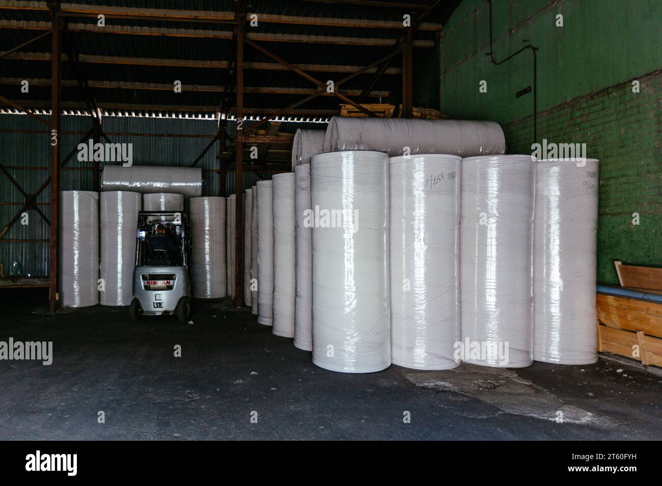Rolls of recycled paper in the warehouse Stock Photo - Alamy