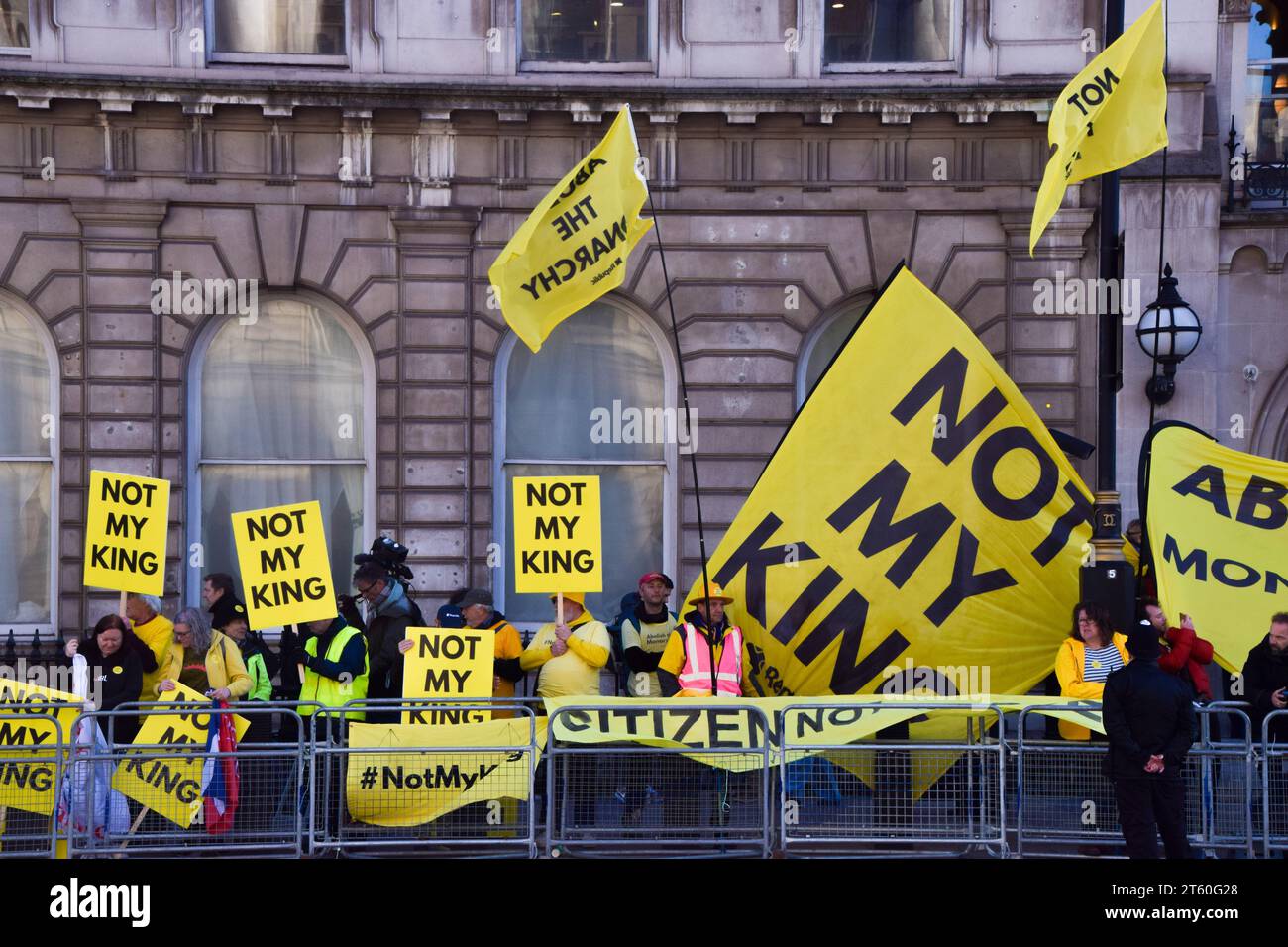 London, UK. 7th November 2023. Protesters hold up Not My King placards ...