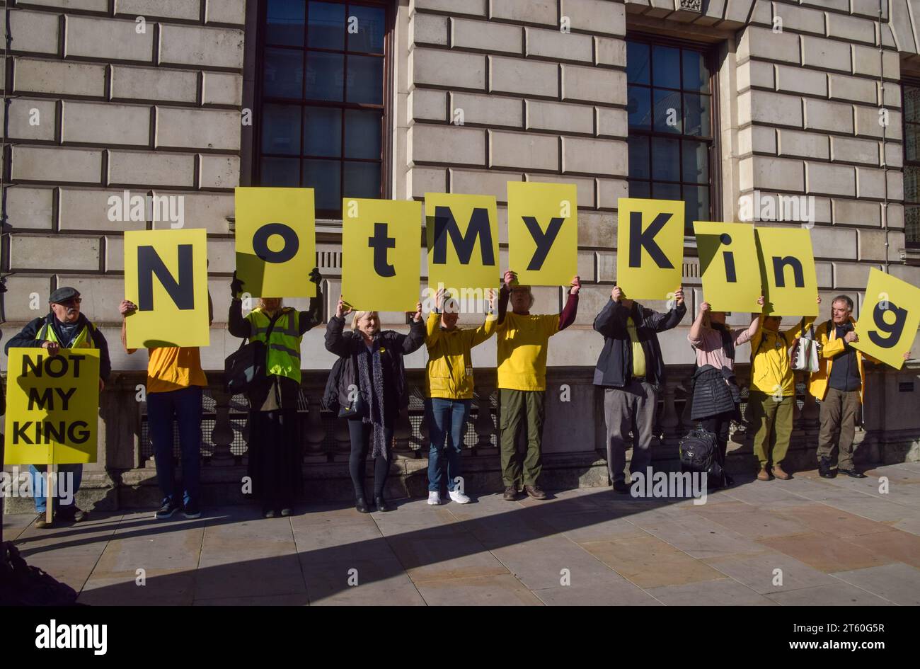 London, UK. 7th November 2023. Protesters hold up Not My King placards ...