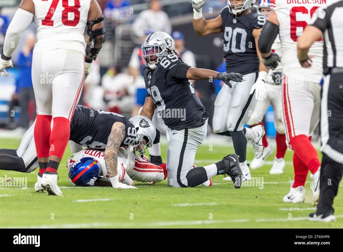 Las Vegas Raiders defensive tackle Adam Butler (69) gets up after sacking New York Giants ...