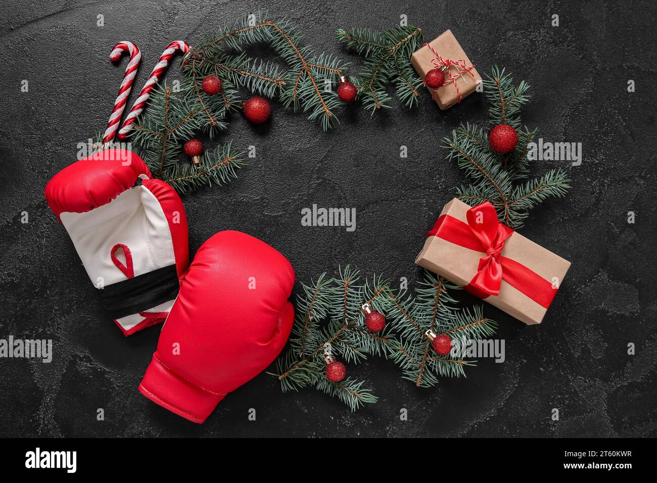 Frame made of boxing gloves with Christmas tree branches, balls and ...