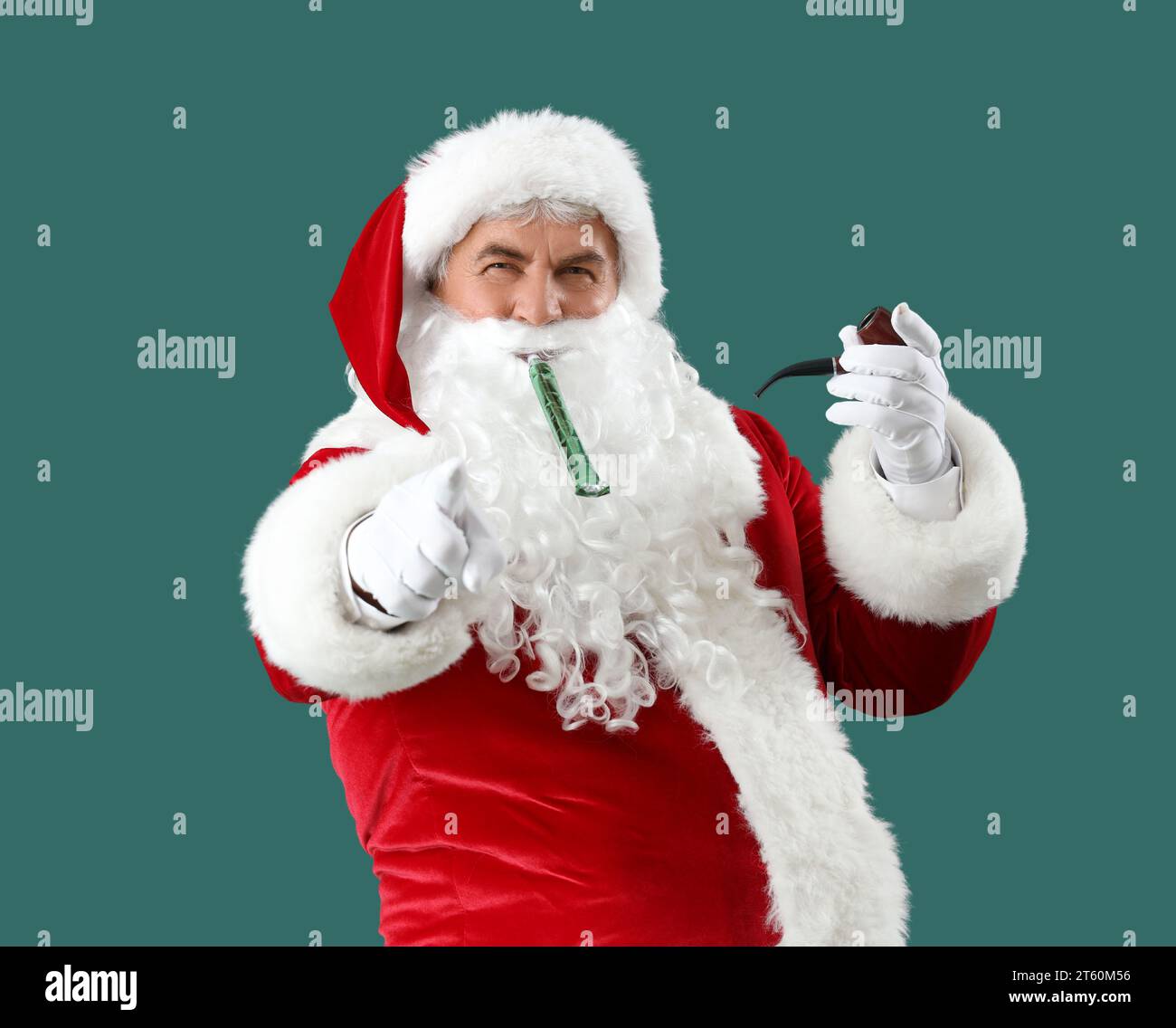 Cool Santa Claus with party blower and smoking pipe pointing at viewer ...