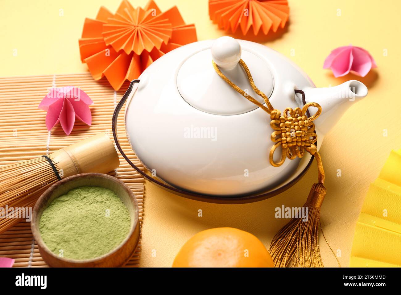 Teapot with mandarin, bowl of powdered matcha tea, chasen and oriental ...