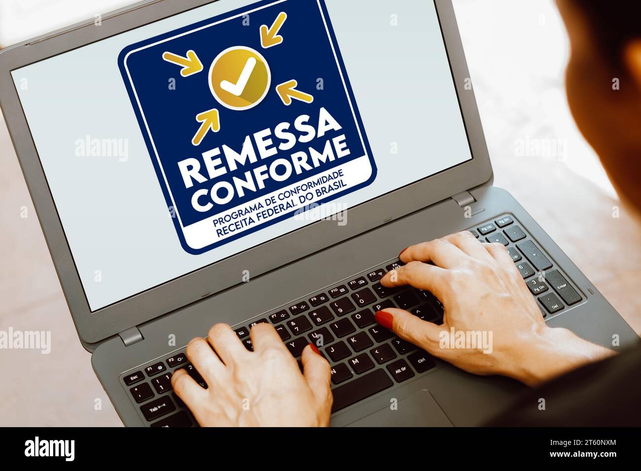 In this photo illustration, the Remessa Conforme logo is displayed on a ...