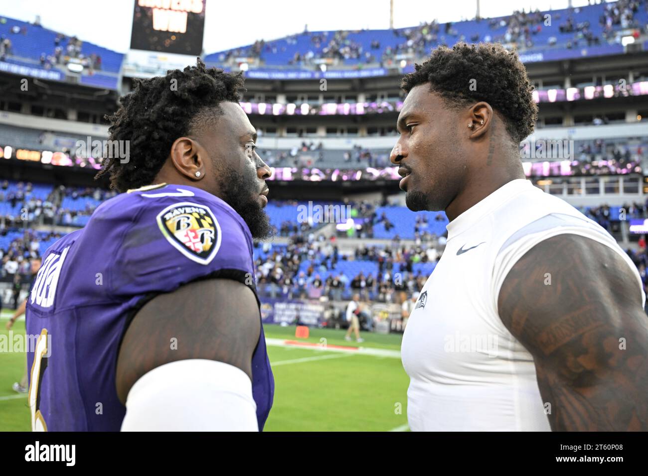 Baltimore Ravens linebacker Patrick Queen, left, and Seattle Seahawks ...