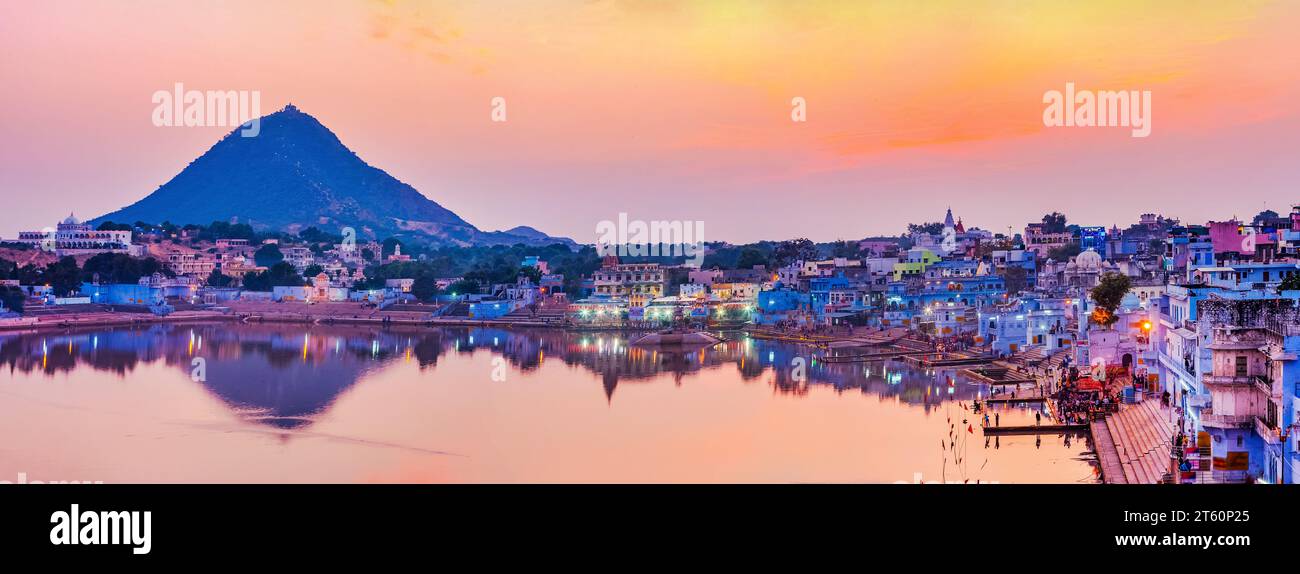 Pushkar Holy Lake at sunset. Hindu pilgrims bathing in sacred Lake ...
