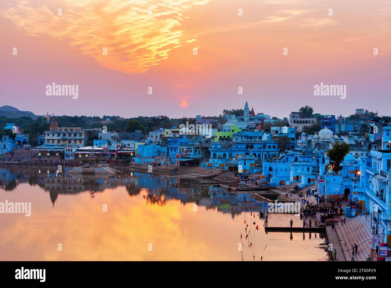 Pushkar Holy Lake at sunset. Hindu pilgrims bathing in sacred Lake ...