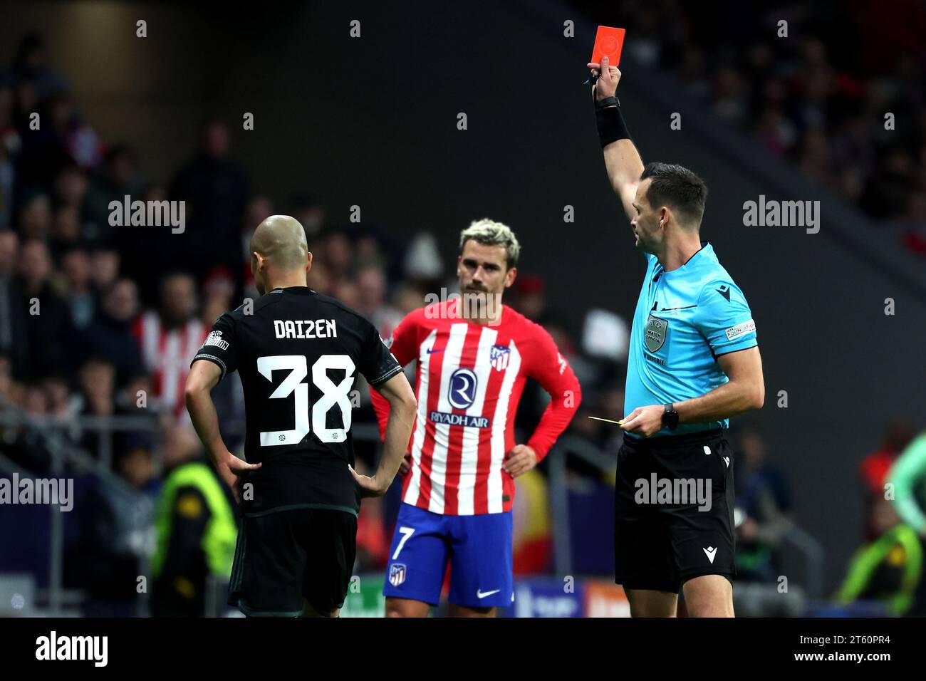 Celtic's Daizen Maeda (left) is shown a red card by referee Ivan ...