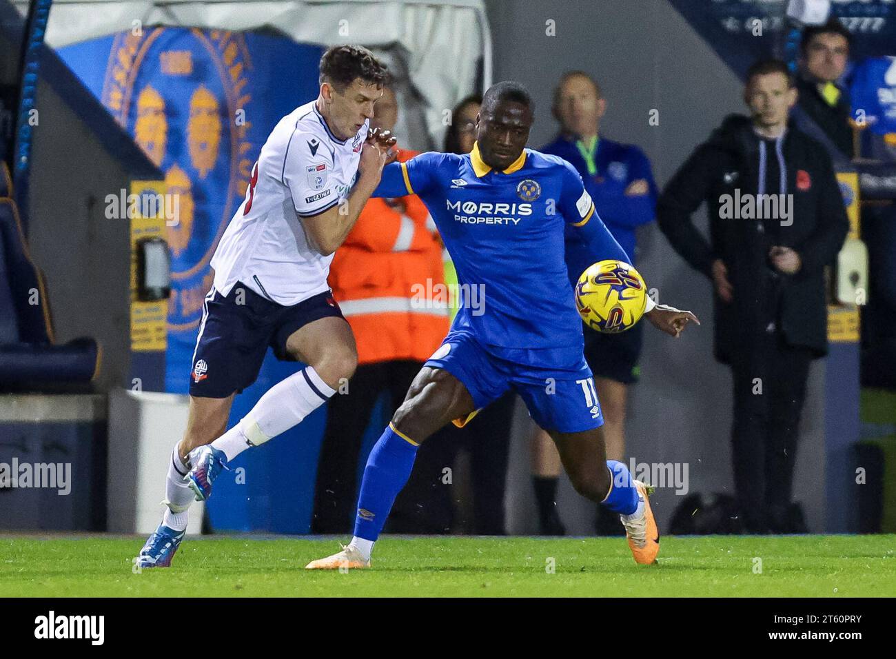 Shrewsbury, UK. 07th Nov, 2023. Bolton's Eoin Toal & Shrewsbury's ...