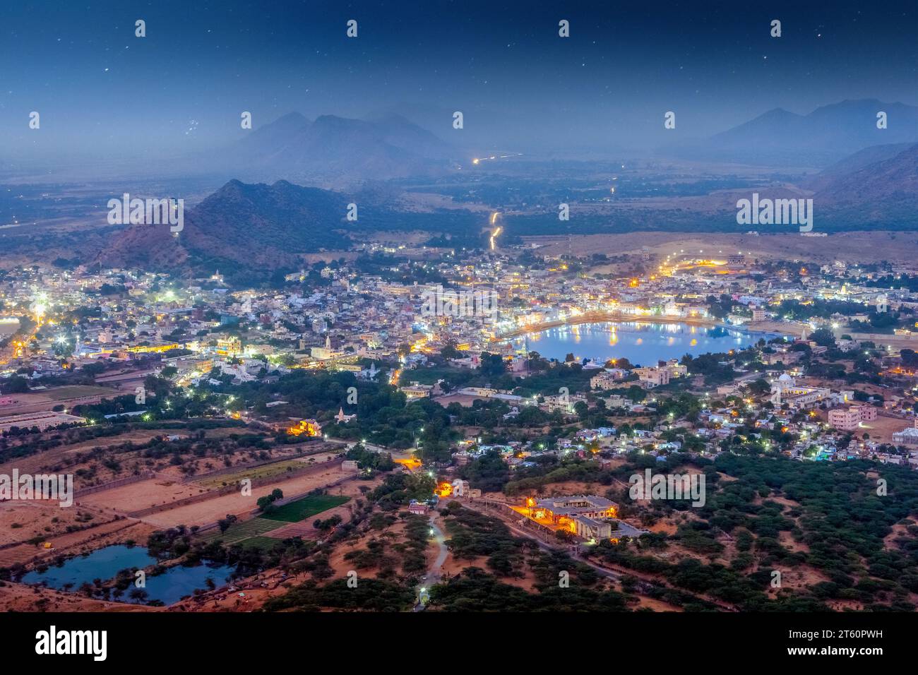 Pushkar Holy lake and Pushkar Holy City at night. Panoramic view from ...