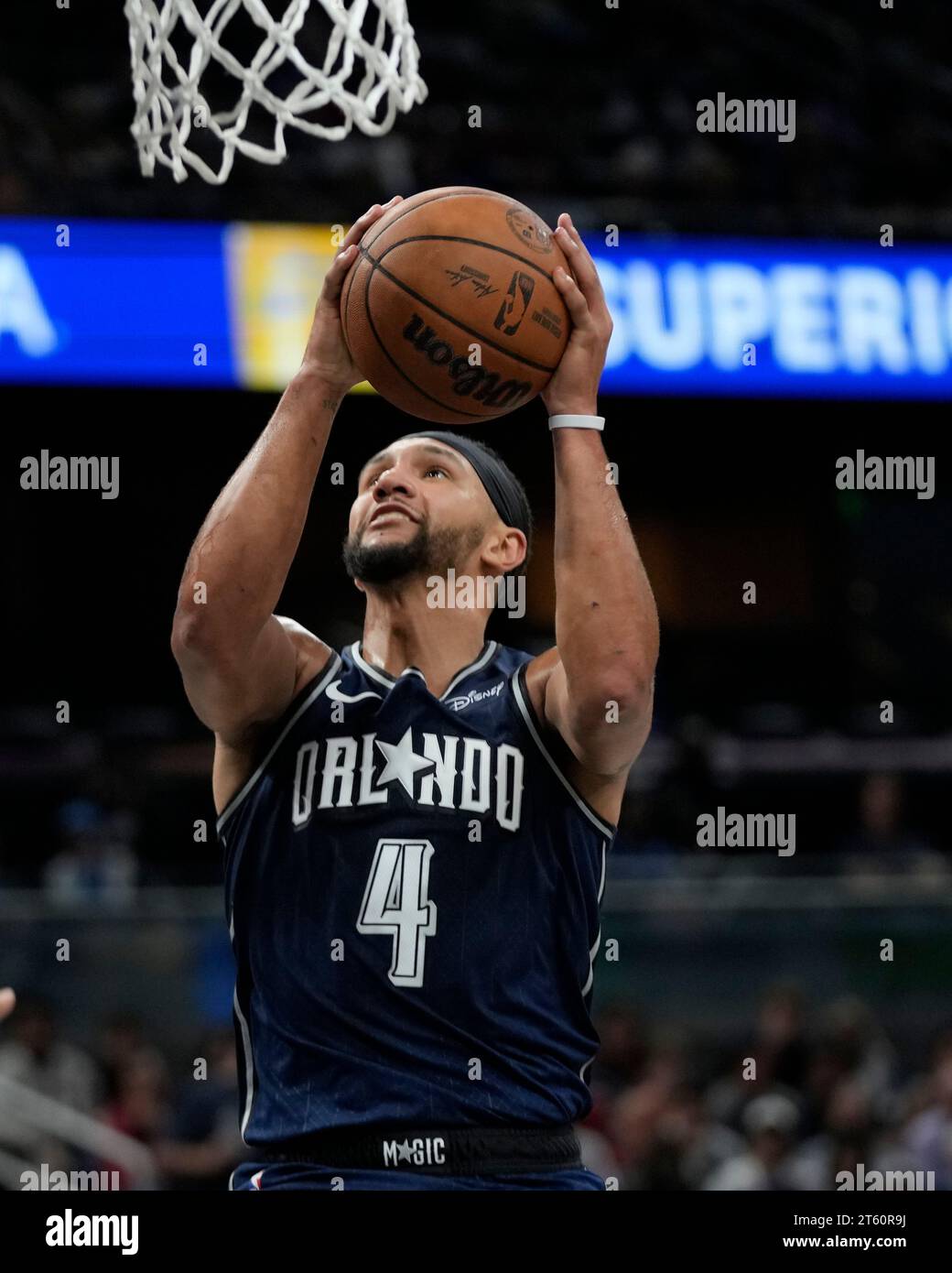 Orlando Magic guard Jalen Suggs (4) goes up for a shot against the ...