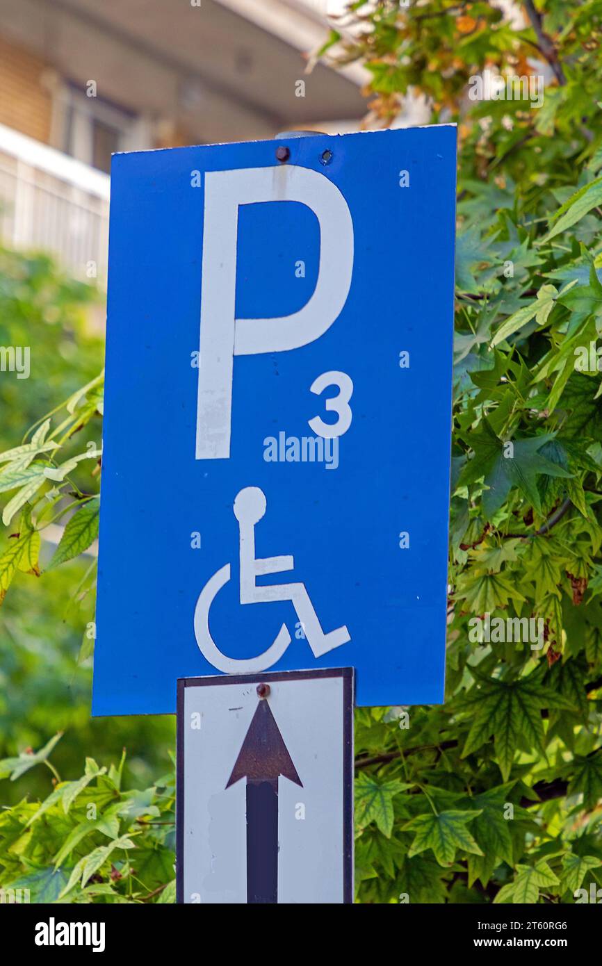 Disable parking spot sign on the street with arrow showing direction to ...