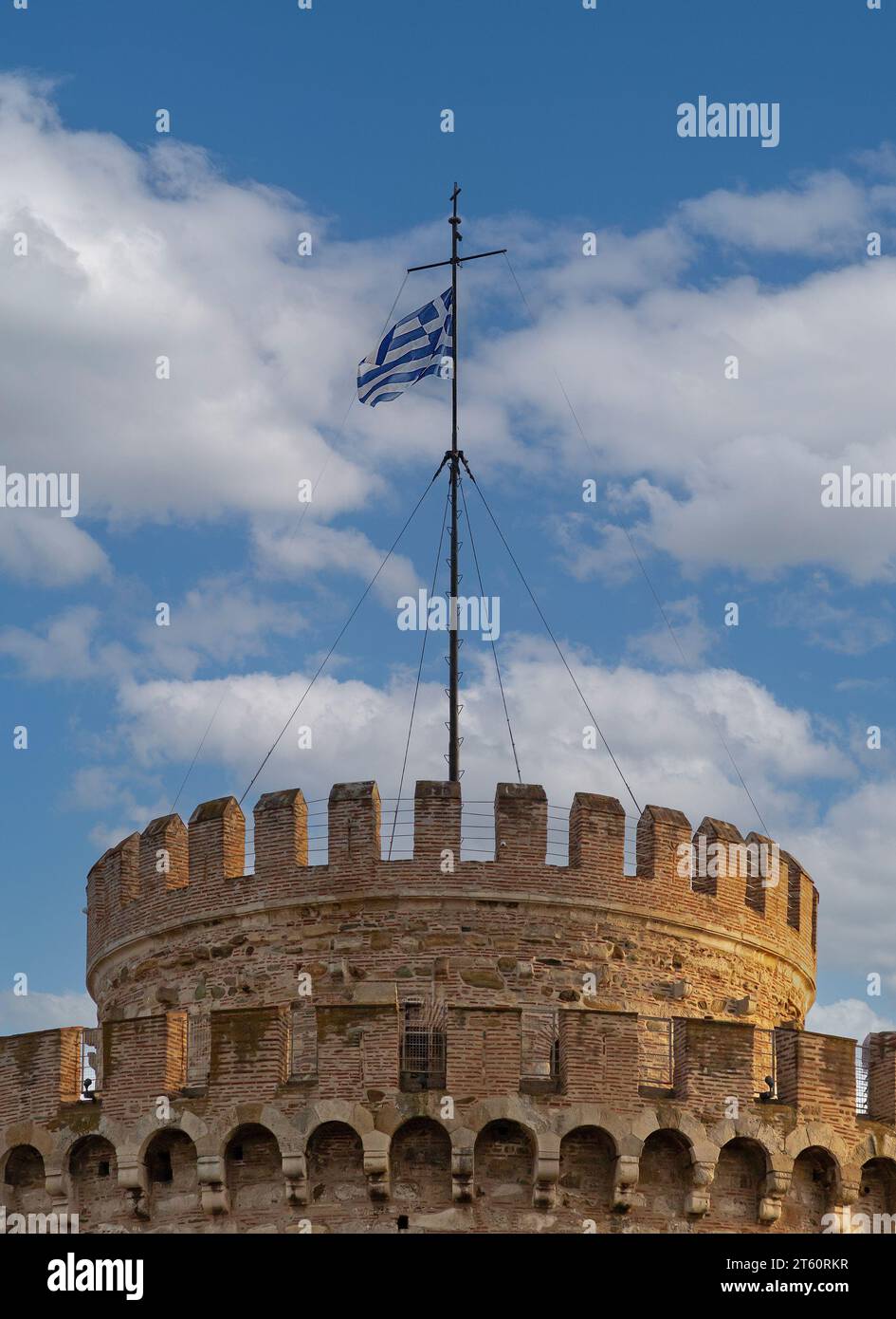 White tower landmark monument and museum with Greek flag on the ...