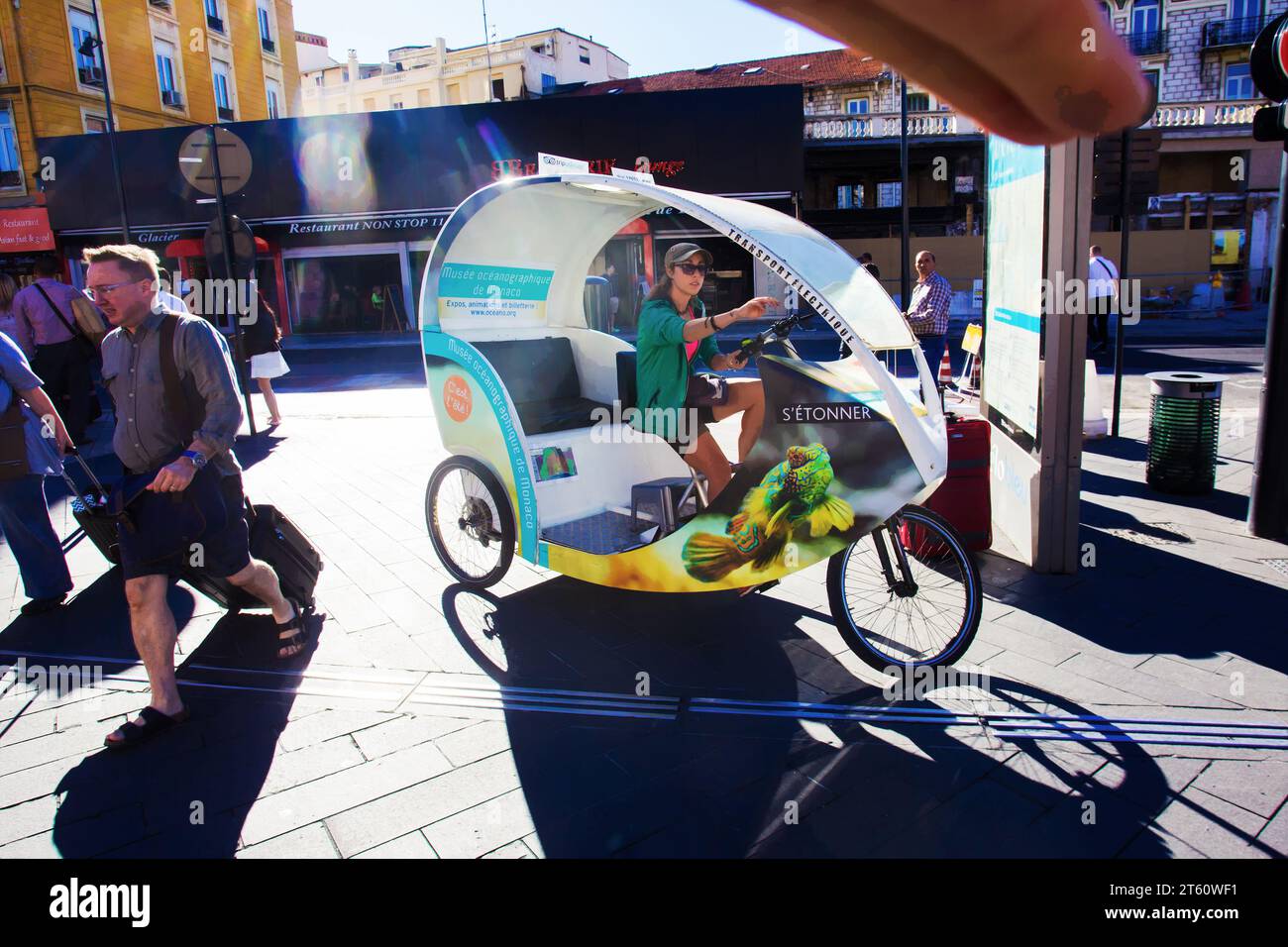 09-24-2015 Nice, France. Rickshaw (young woman) in Nice. Next to ...