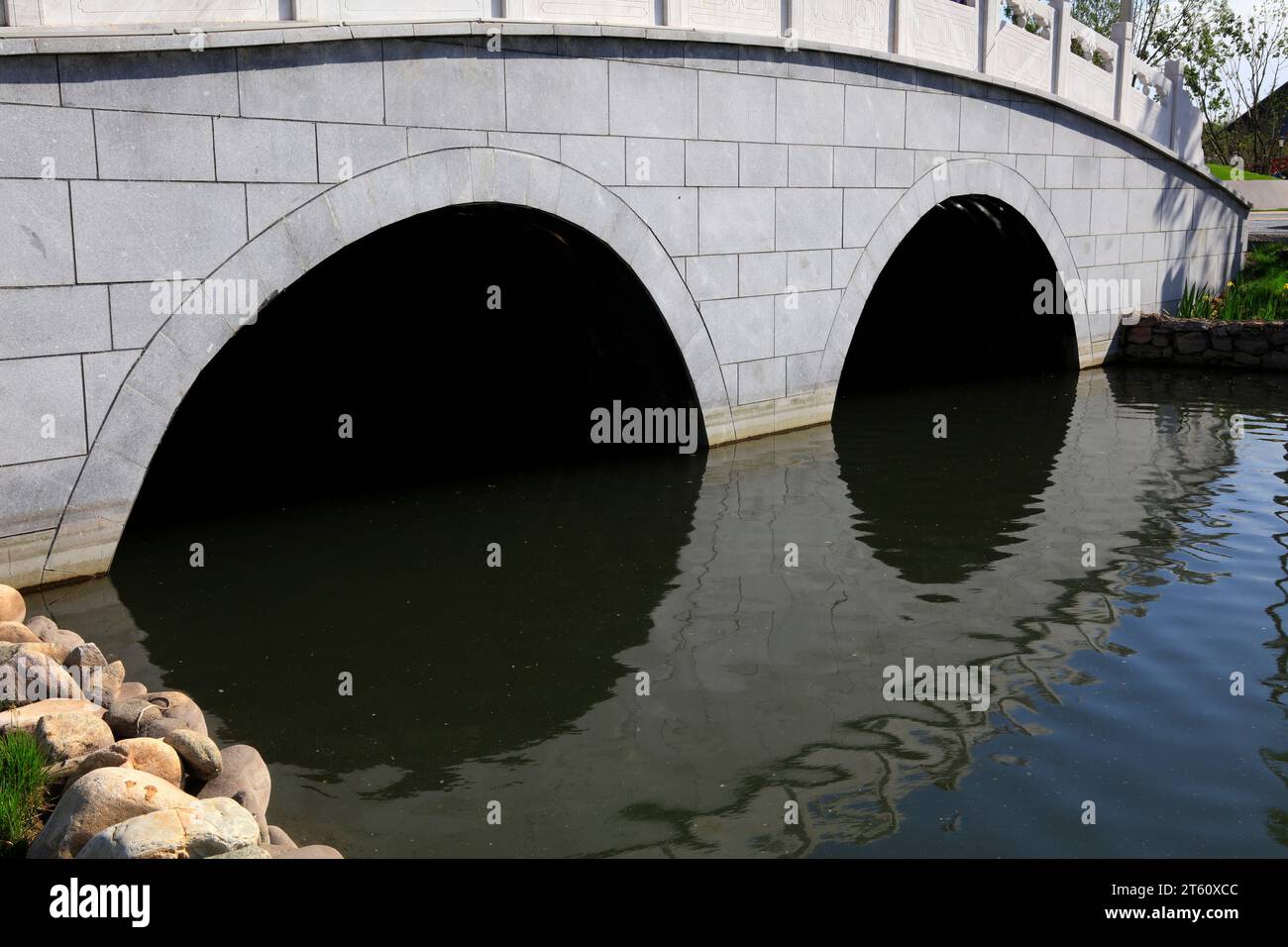 Double arch stone bridge in Chinese architectural style Stock Photo - Alamy