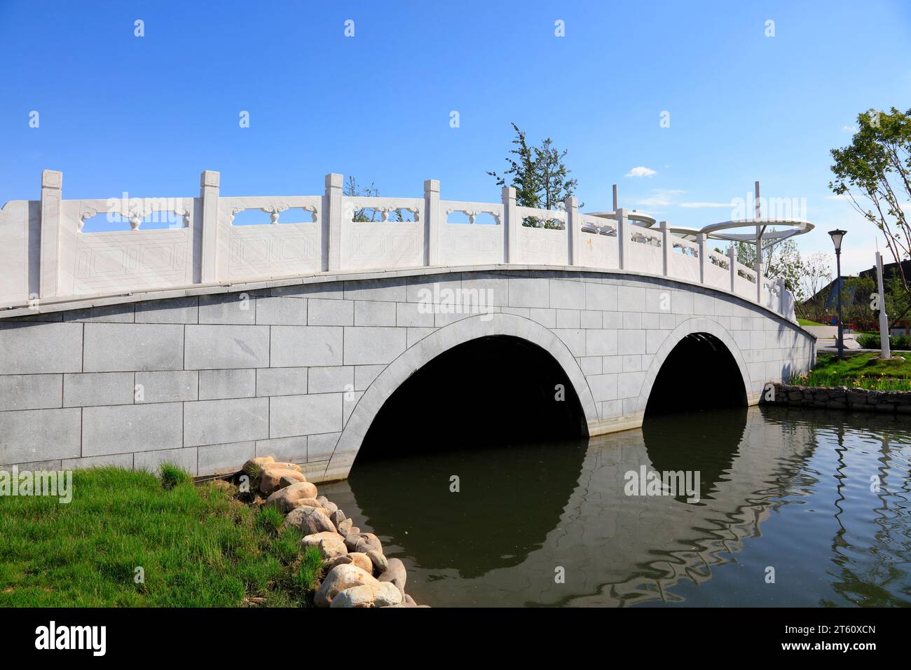 Double arch stone bridge in Chinese architectural style Stock Photo - Alamy