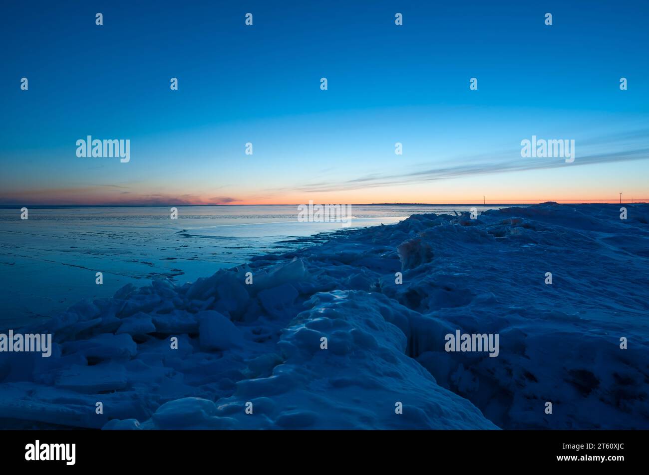 The frozen shores of Gulf of Bothnia in winter in Finland with packed ...
