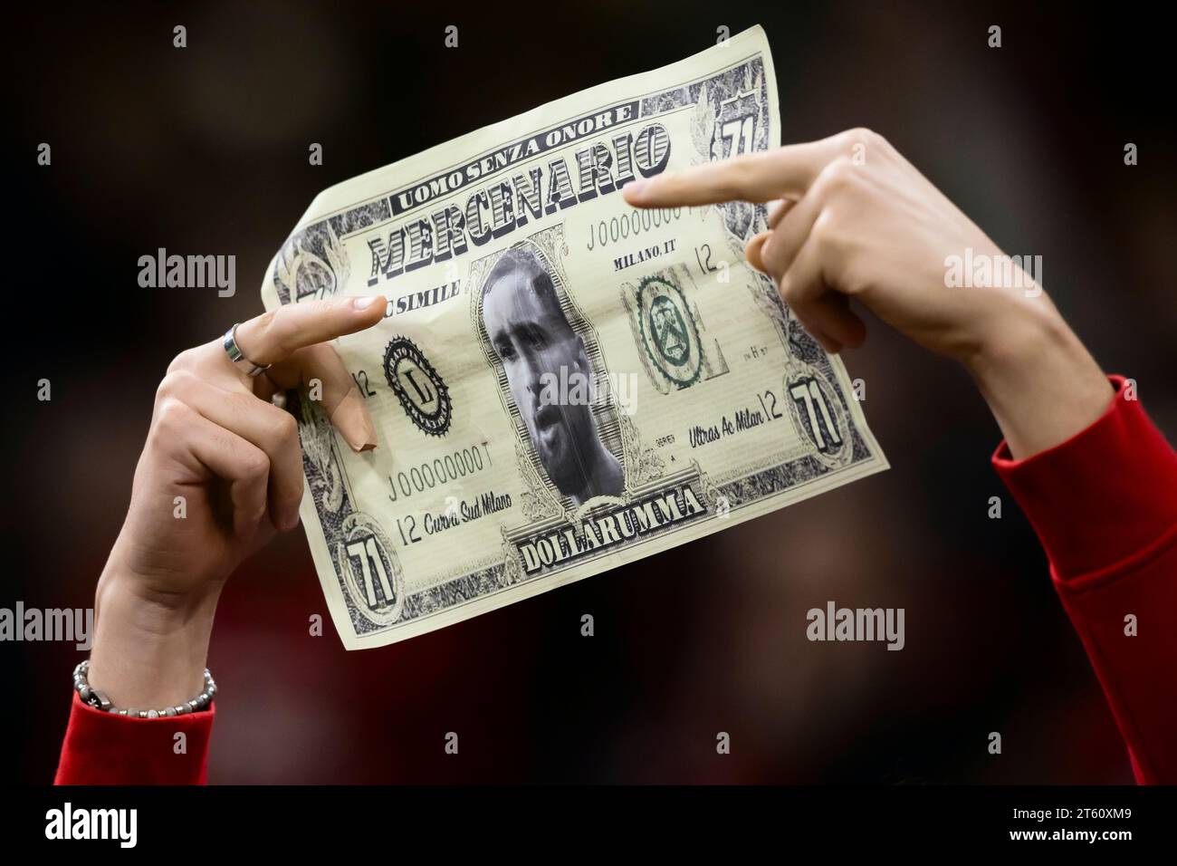 Milan, Italy. 7 November 2023. A fan of AC Milan holds up fake money ...