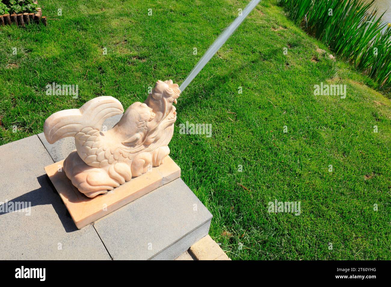 dragon head water spray sculpture Stock Photo - Alamy