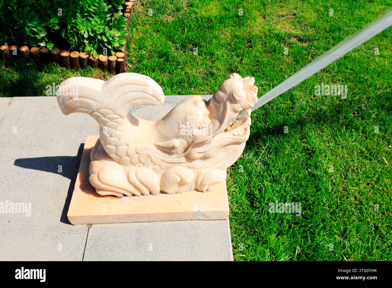dragon head water spray sculpture Stock Photo - Alamy