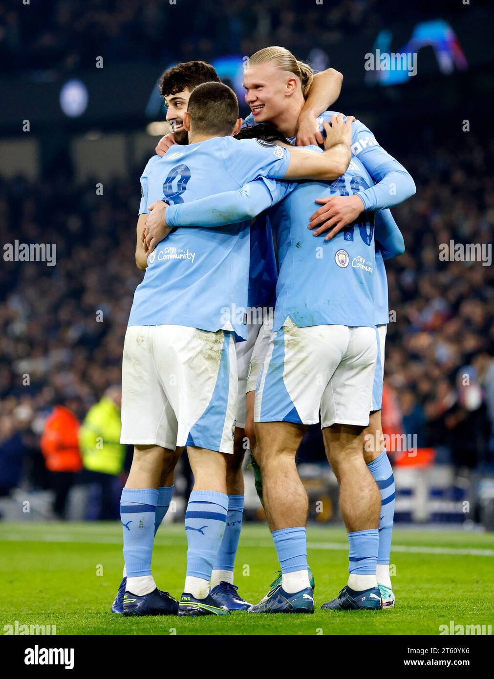 Manchester City's Erling Haaland (right) celebrates with team-mates ...