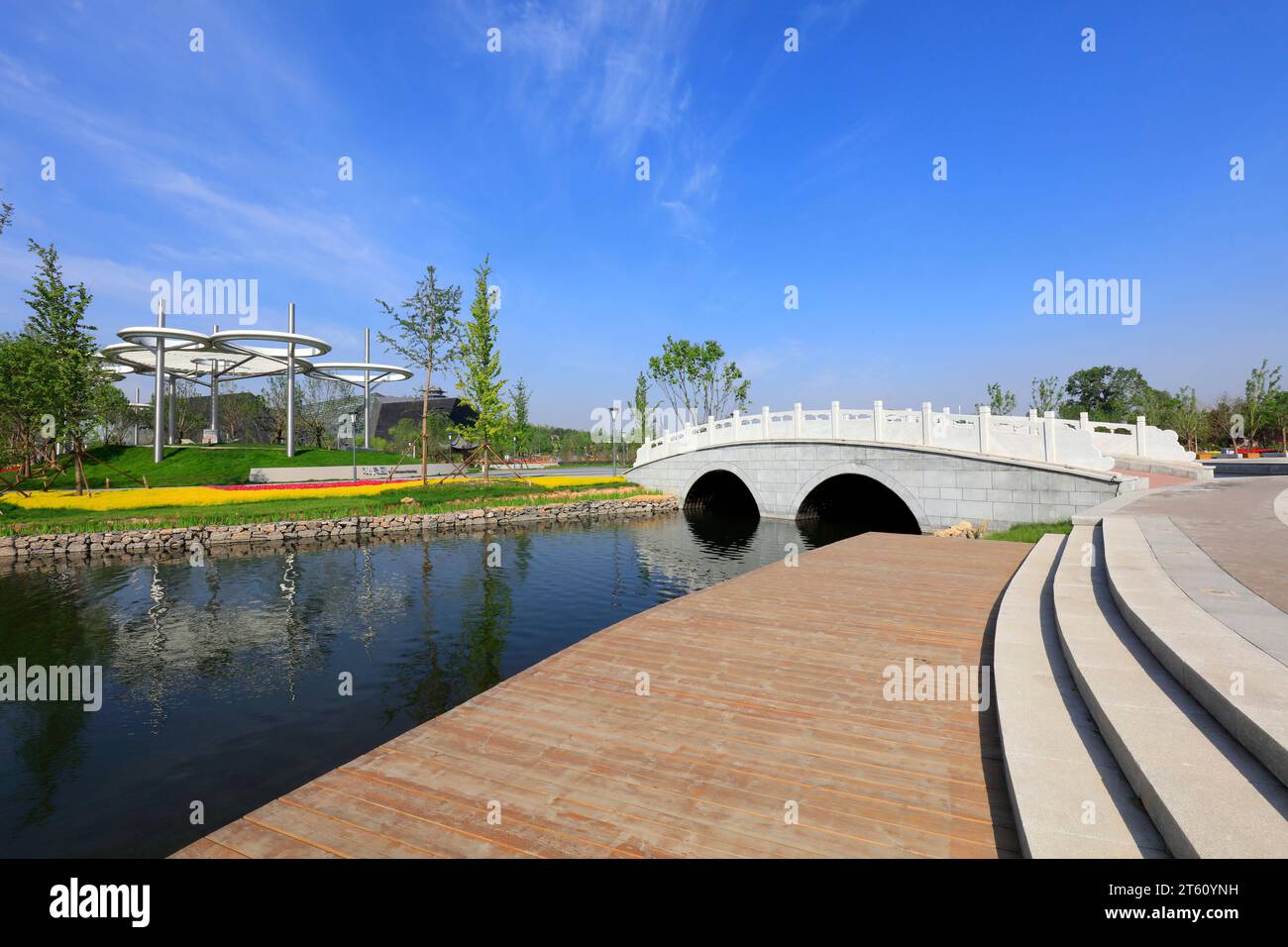 Double arch stone bridge and wooden platform Stock Photo - Alamy