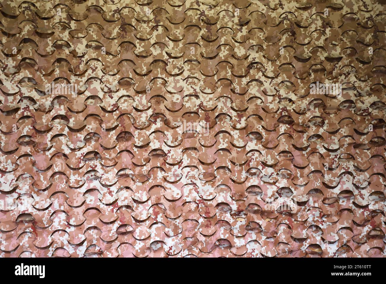 Camouflage net texture on high wall outdoors as background close up ...