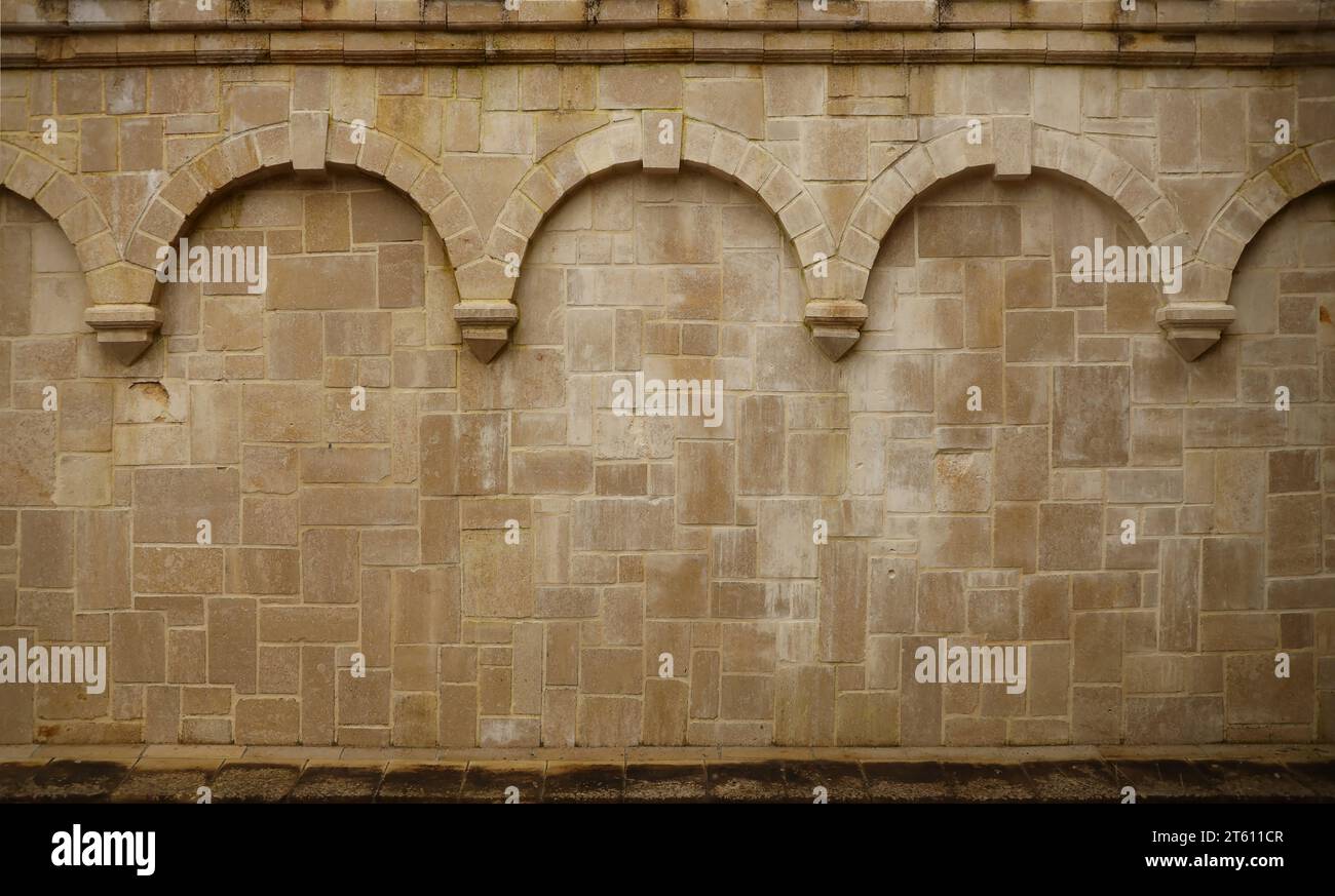 Repeating columns on a block wall in a medieval church in Rouen France ...