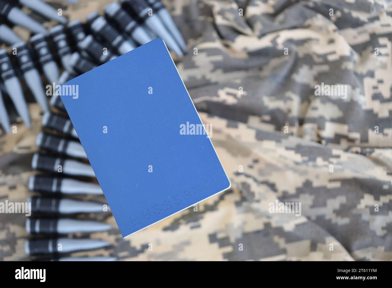 Ukrainian foreign passport on fabric with texture of military pixeled ...