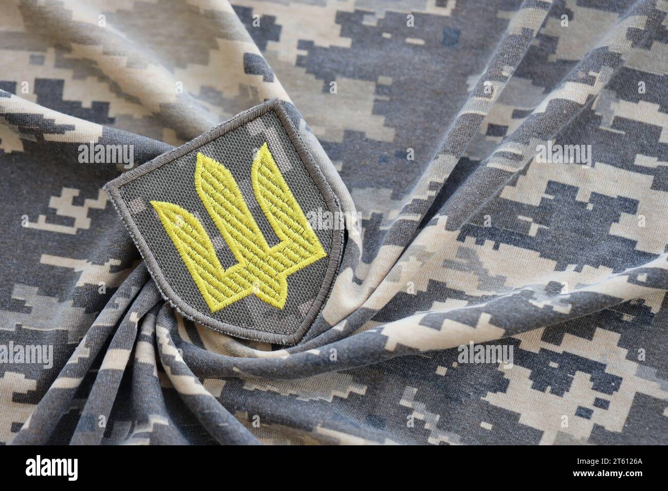 Symbol of Ukrainian army on the camouflage uniform of a Ukrainian ...