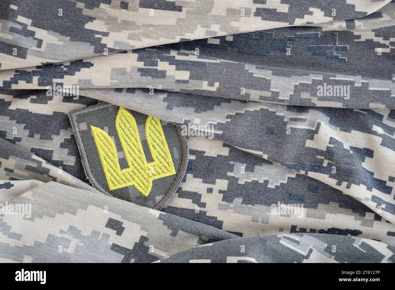 Symbol of Ukrainian army on the camouflage uniform of a Ukrainian ...