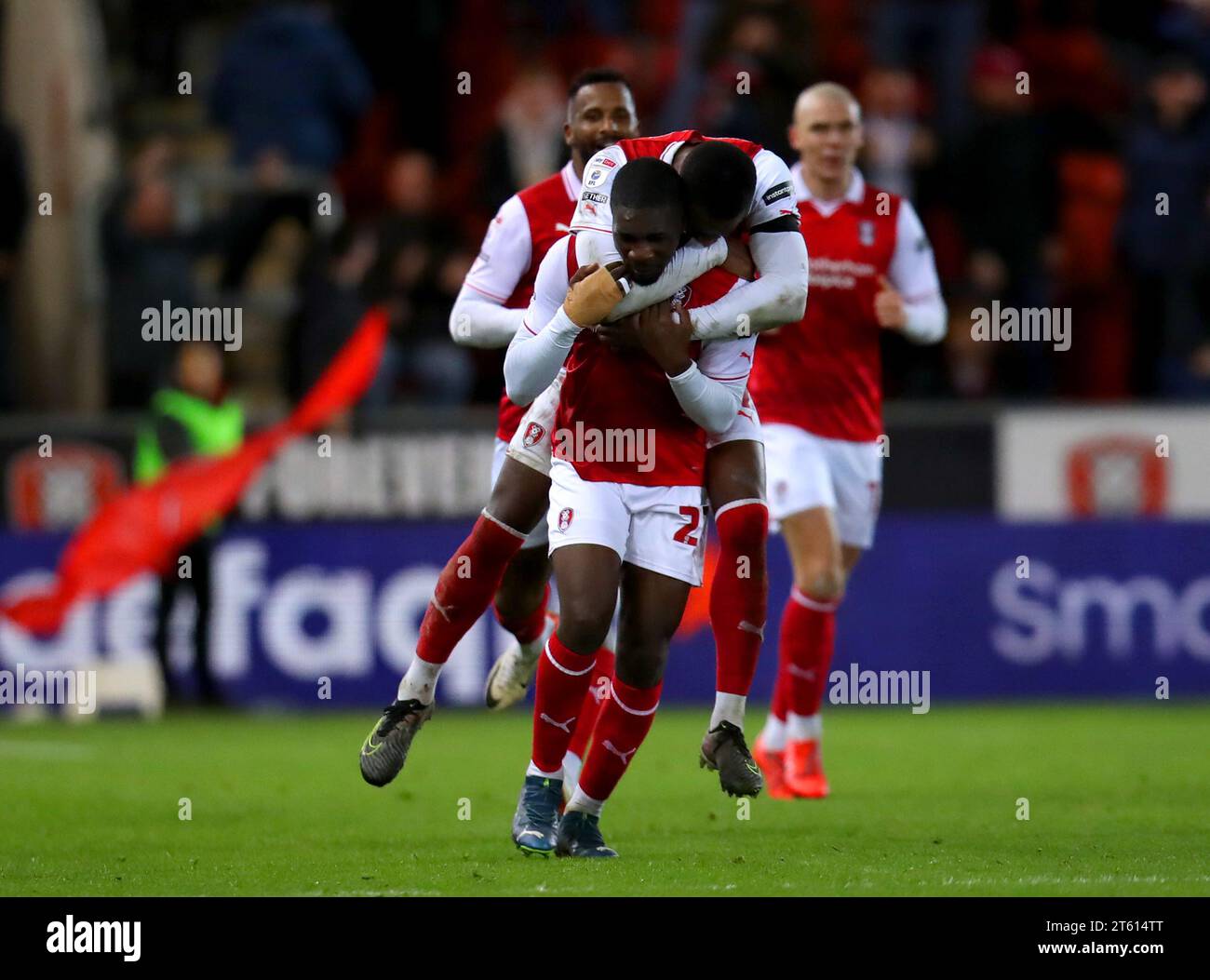 Rotherham United's Christ Tiehi (bottom) celebrates with Hakeem Odoffin ...