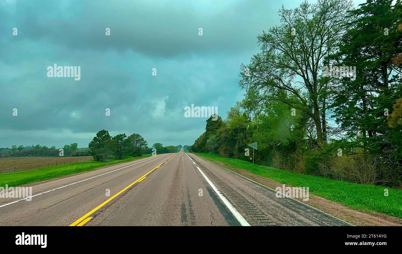 Driving through the countryside on Interstate 20 Nebraska with farms on ...