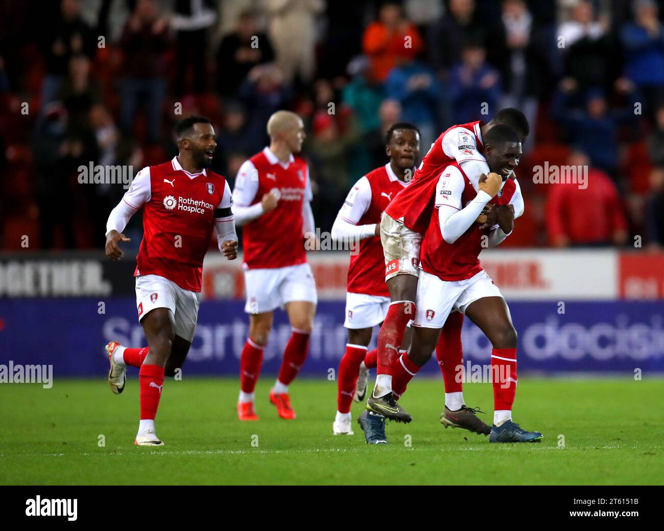 Rotherham United's Christ Tiehi (bottom right) celebrates with Hakeem ...