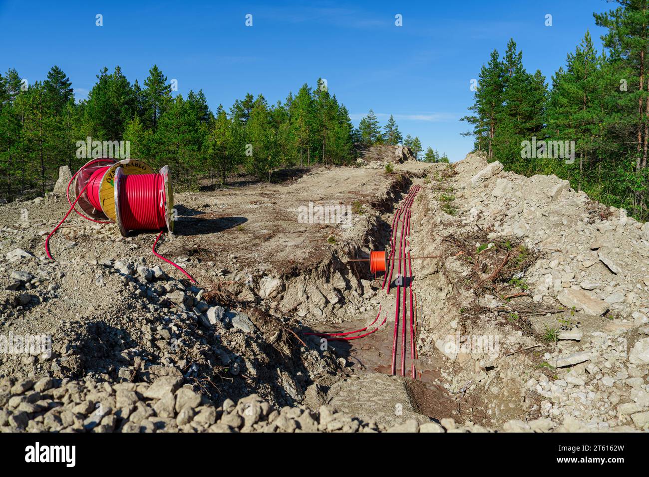 Laying High-Voltage Cables Underground Through the Forest to Connect ...