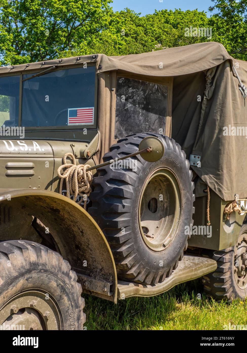Side view view of an American military vehicle, jeep, showing a spare ...