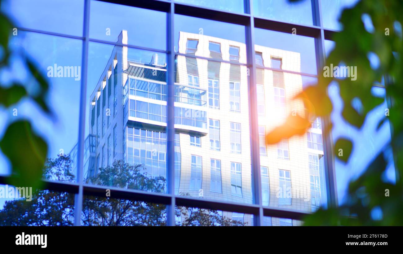 Looking up blue modern office building. The glass windows of building ...
