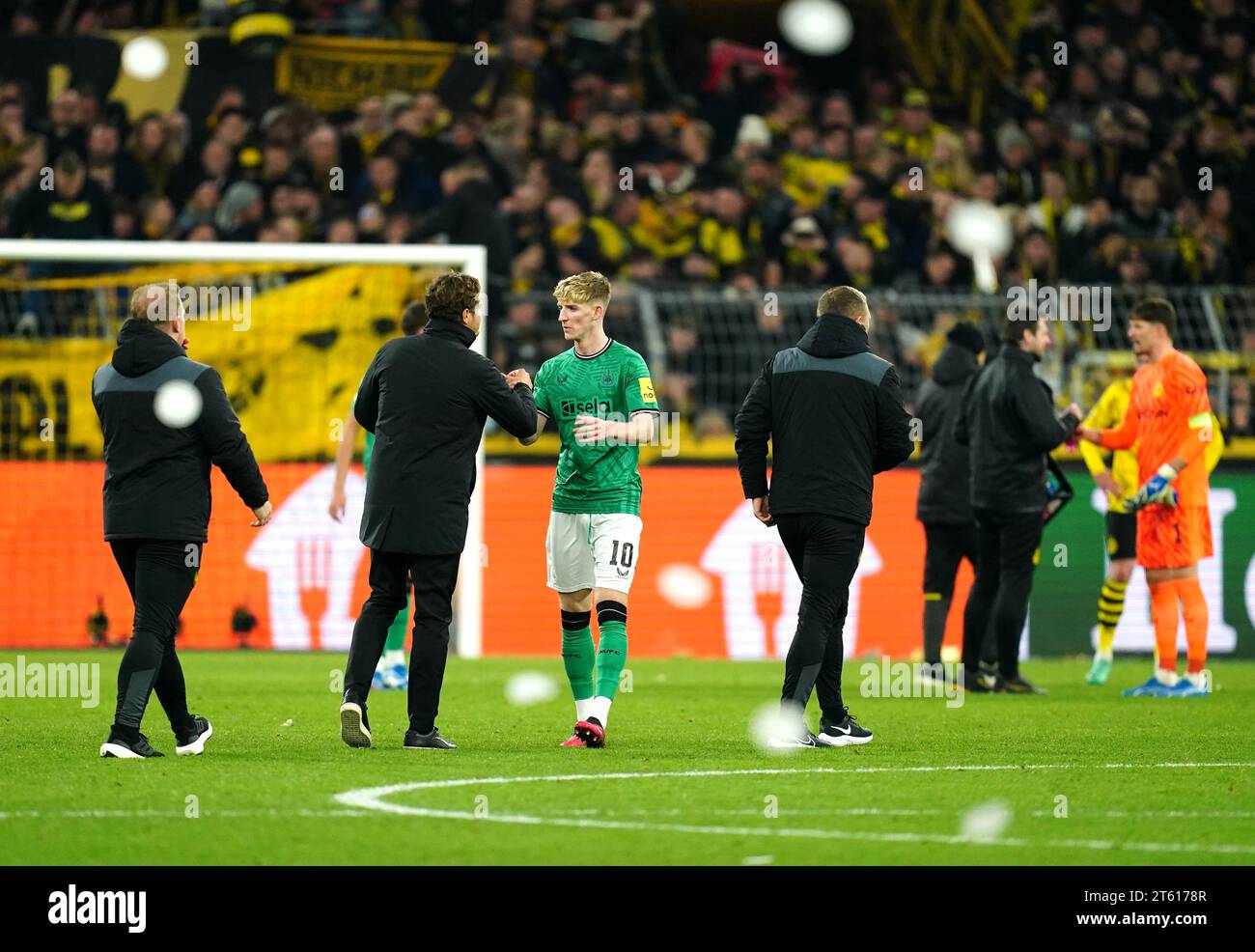 Borussia Dortmund manager Edin Terzic greets Newcastle United's Anthony ...