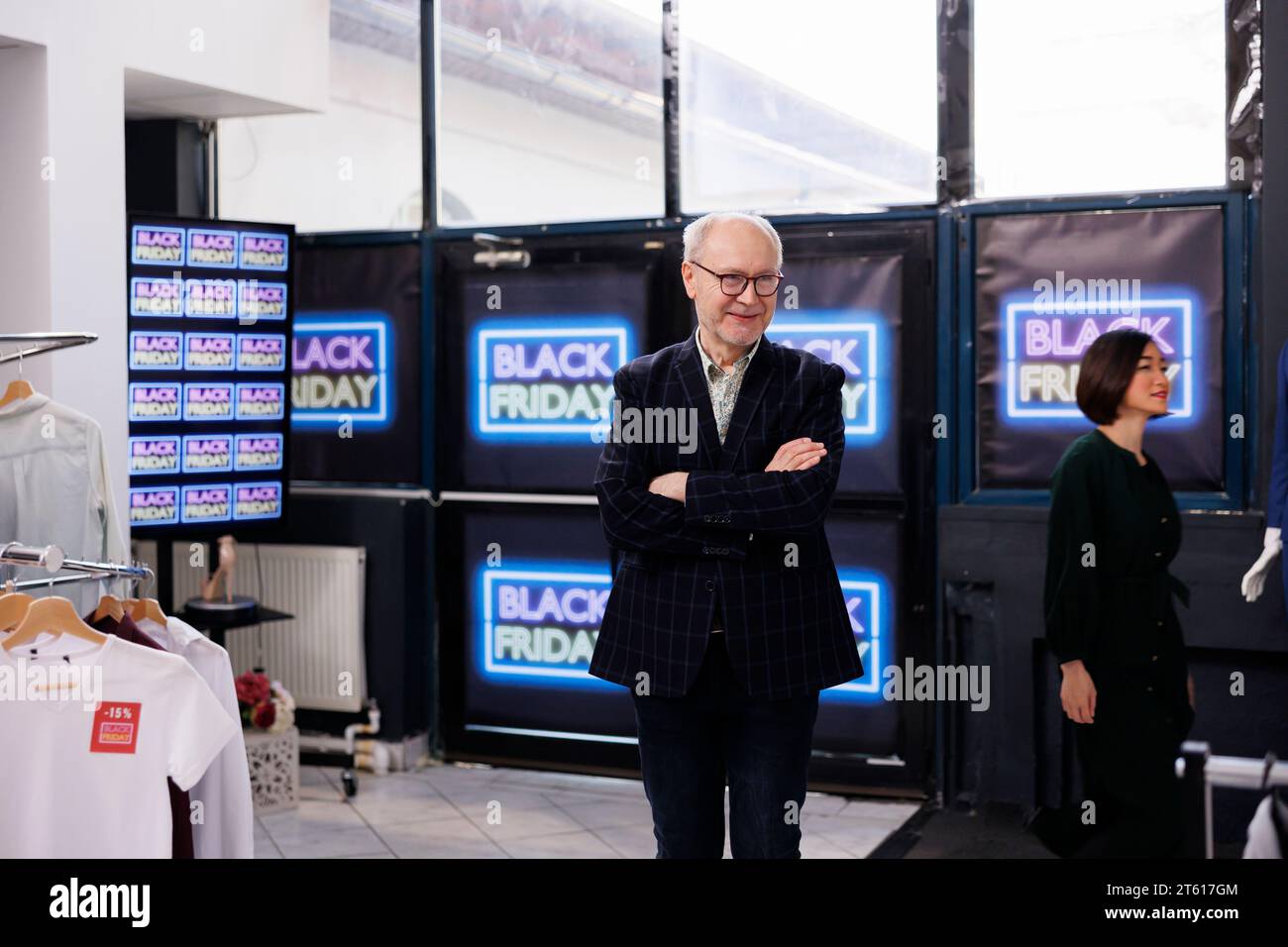 Friendly senior retail business owner wearing formal suit standing in ...