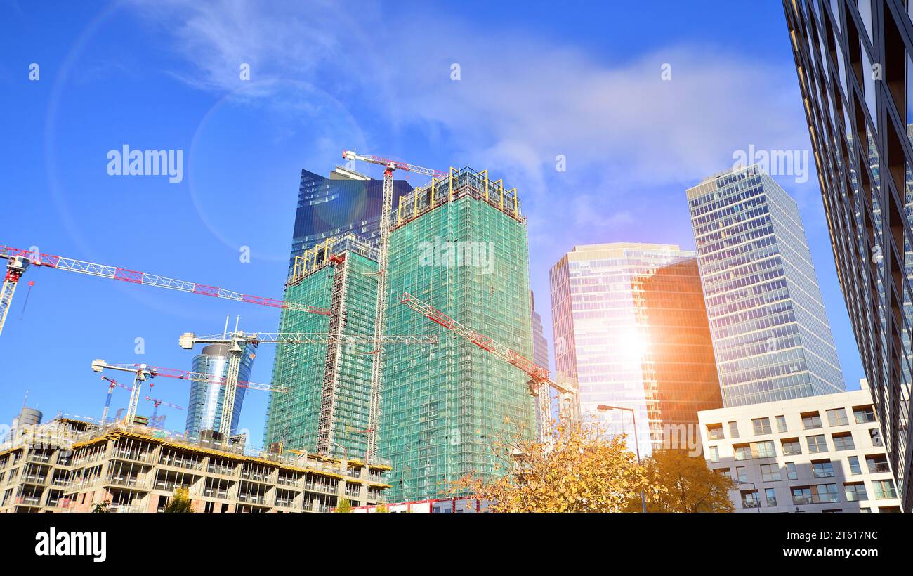 High rise building under construction. Installation of glass facade ...