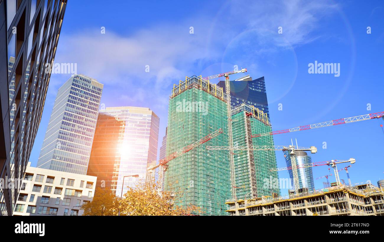 High rise building under construction. Installation of glass facade ...