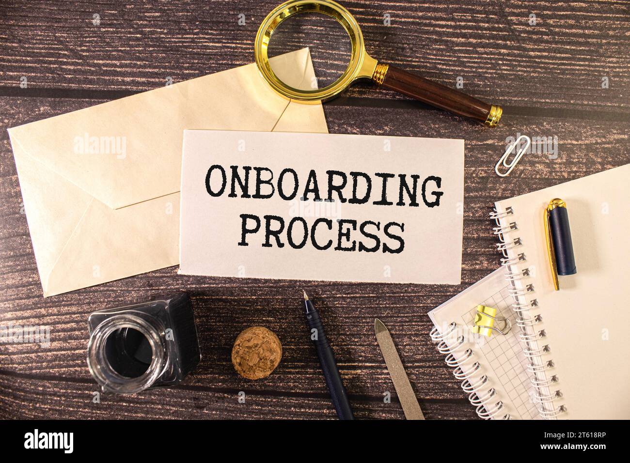 Closeup on businessman holding a card with ONBOARDING PROCESS message ...