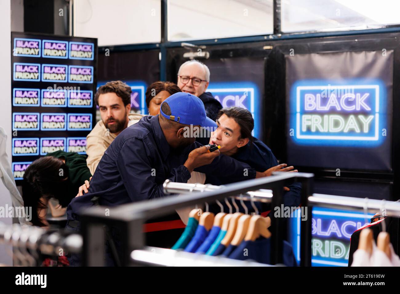 Out of control crowd of mad frenzy shoppers breaking into shopping mall ...